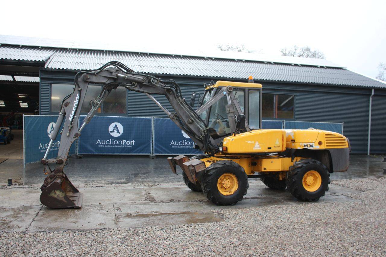 Pelle sur pneus Mecalac 12 MX Diesel 56 kW 2000 enchère | Auct...